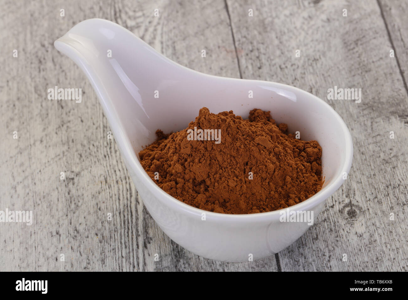 Cocoa powder in the bowl - ready for cooking Stock Photo - Alamy