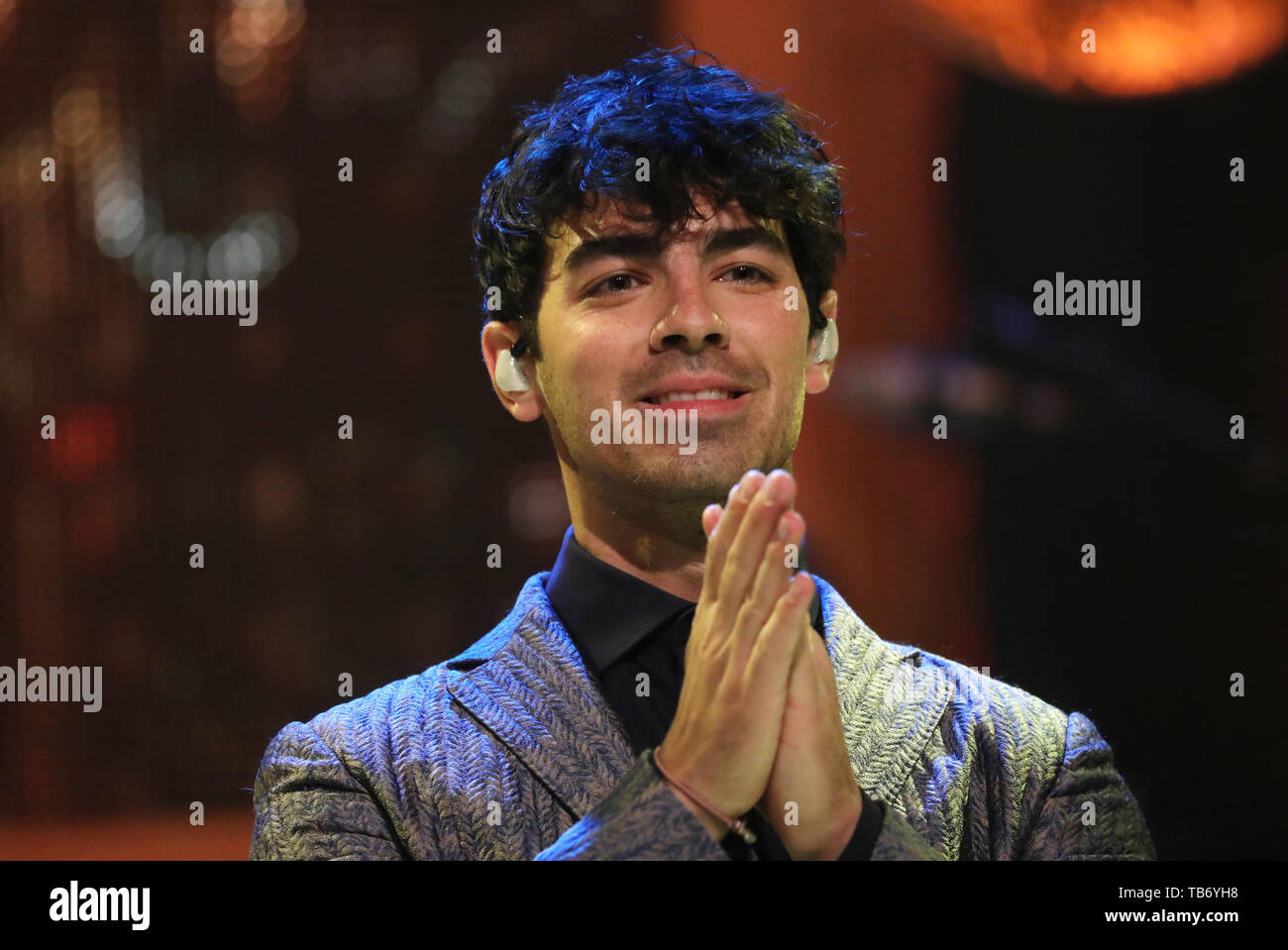 Joe Jonas of the Jonas Brothers performing during the filming for the ...