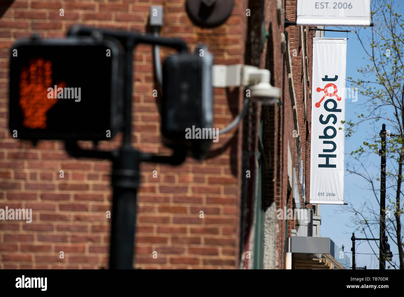 A logo sign outside of the headquarters of HubSpot in Cambridge ...