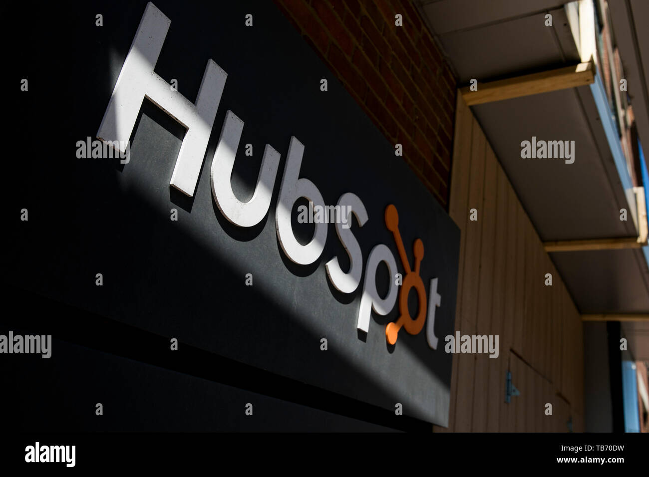 A logo sign outside of the headquarters of HubSpot in Cambridge ...