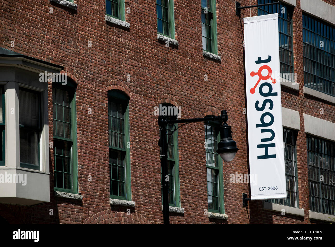 A logo sign outside of the headquarters of HubSpot in Cambridge ...