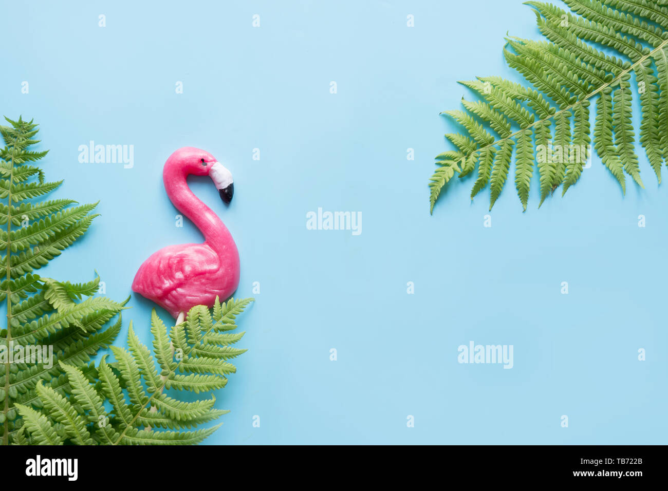 One pink flamingo candy lollipop on blue background. Top view. Fun ...