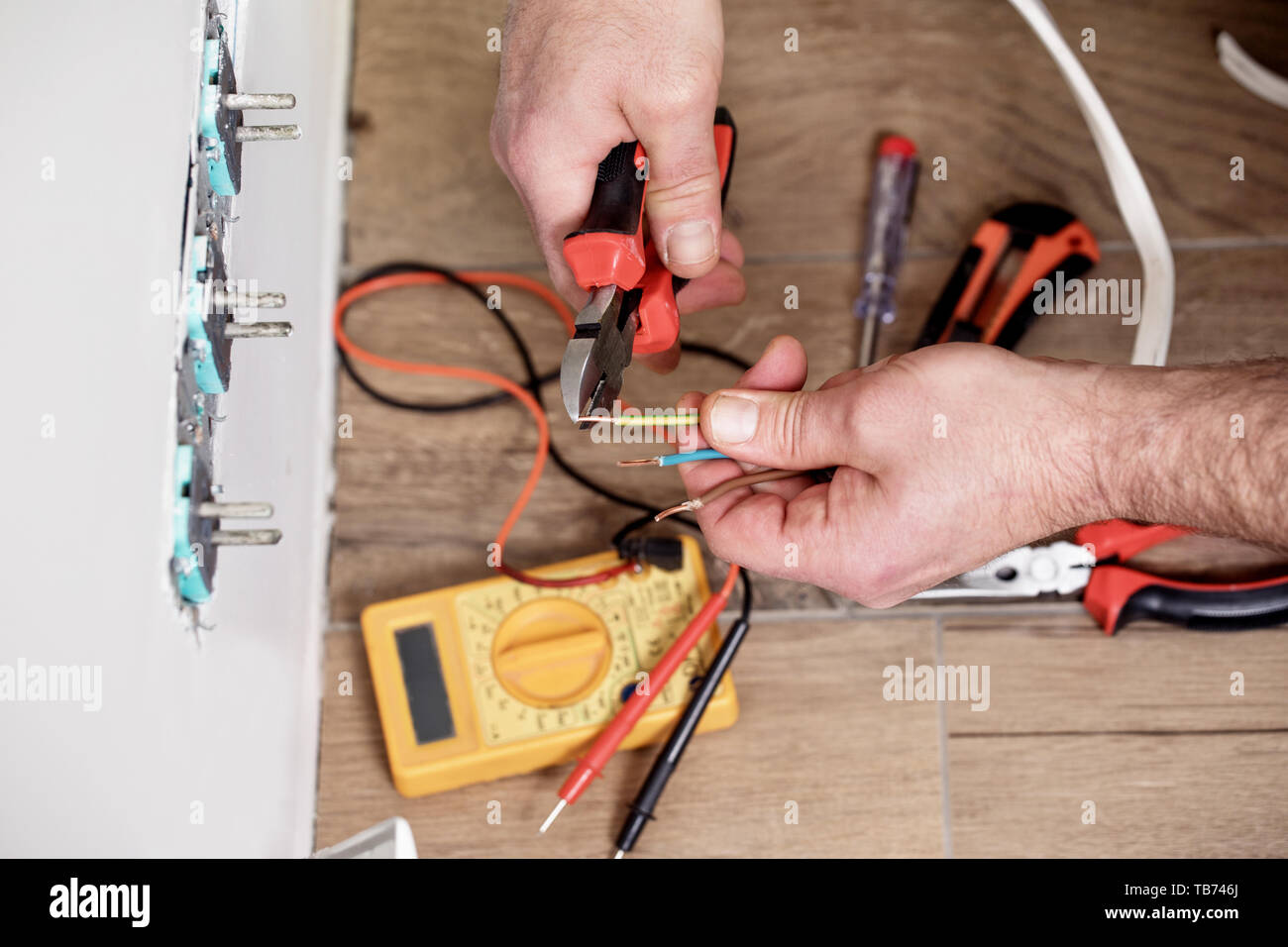 electrician at work, home renovation, electrical installation, Hand of ...