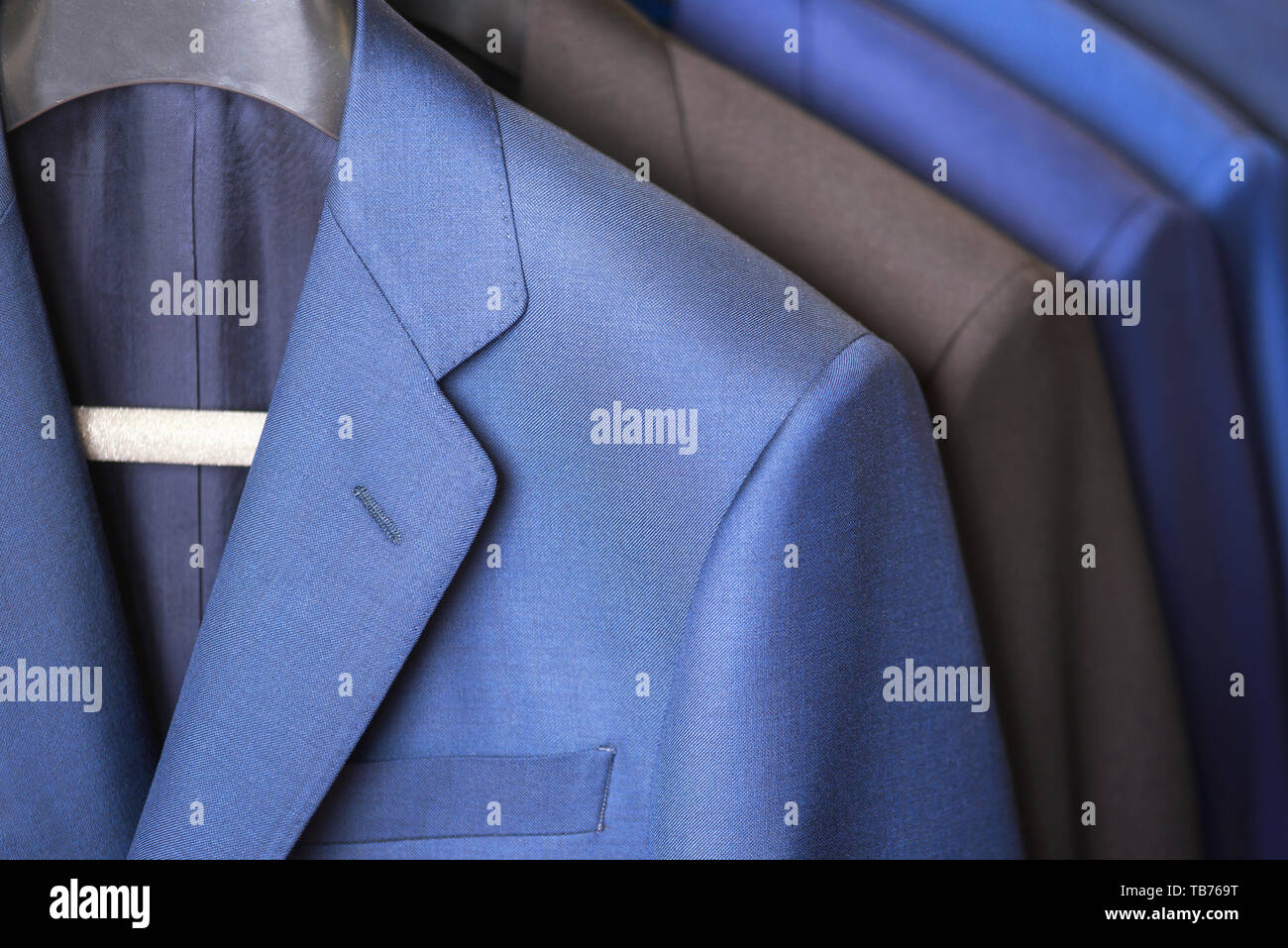 Suits hanging in closet lifestyle hi-res stock photography and images ...