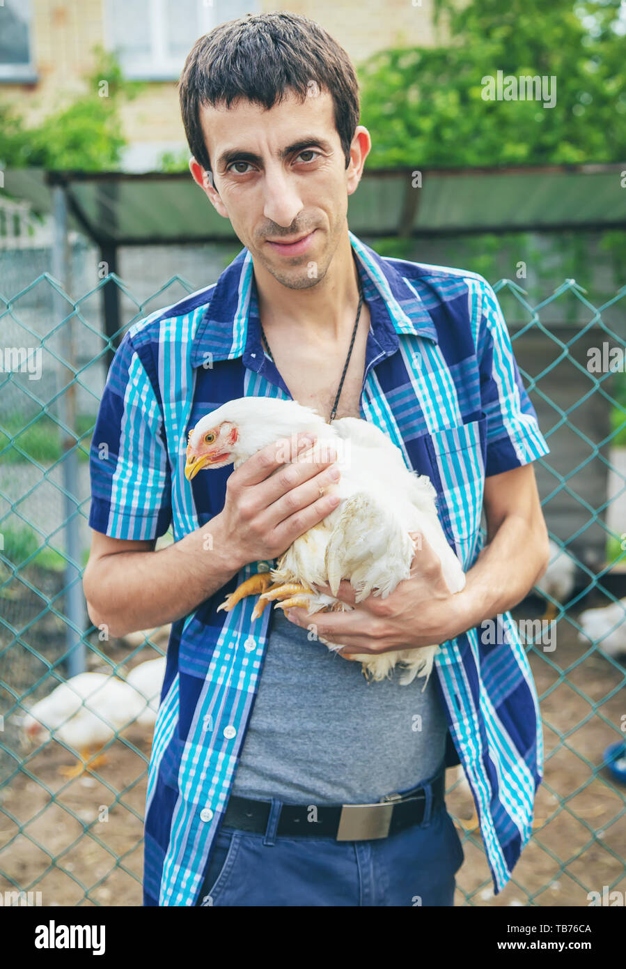 Woman carrying a chicken hi-res stock photography and images - Alamy