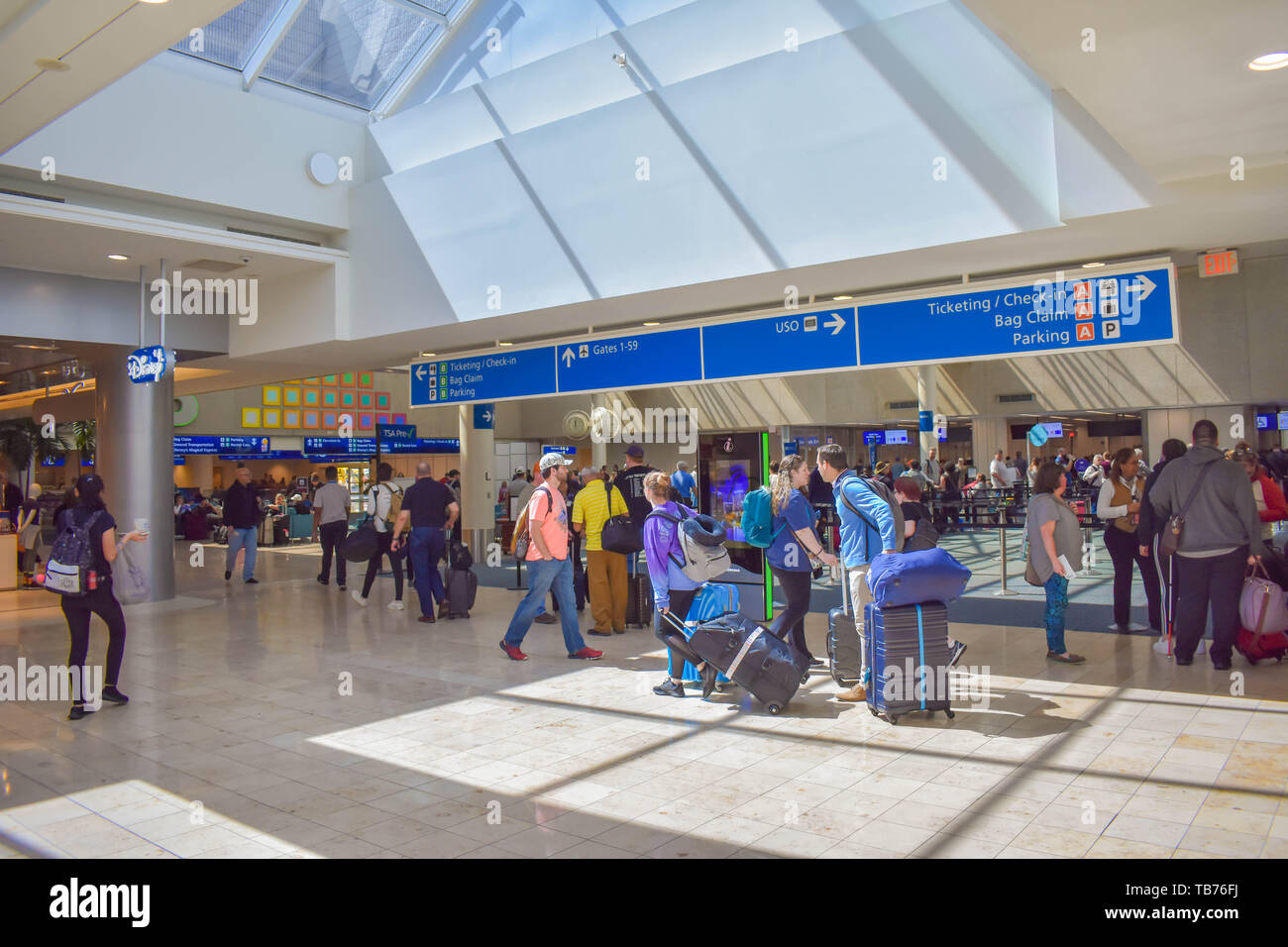 Orlando, Florida. March 01, 2019. People walking to different terminals ...