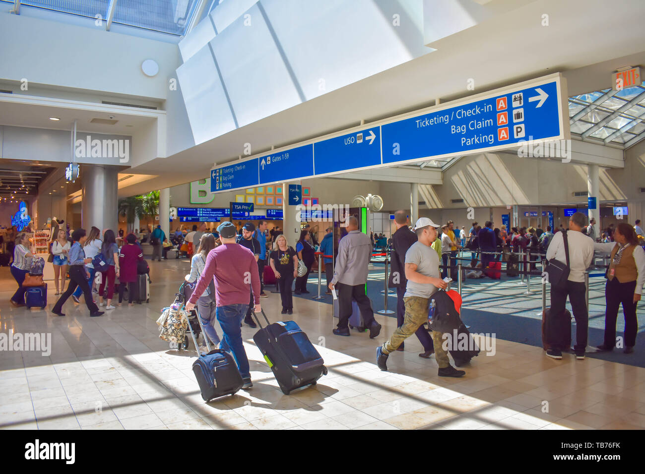 Orlando, Florida. March 01, 2019. People walking to different terminals ...