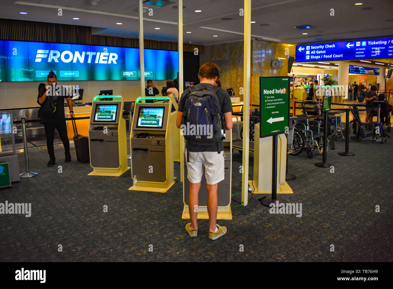 Orlando, Florida. March 01, 2019. Man using Self service check-in at ...