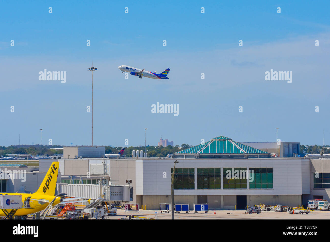 Orlando, Florida. March 02, 2019. Spirit Airlines aircraft banking left ...