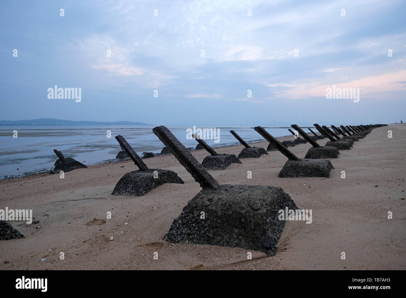 Aging anti-landing barricades sit on a beach on the shore of Kinmen ...