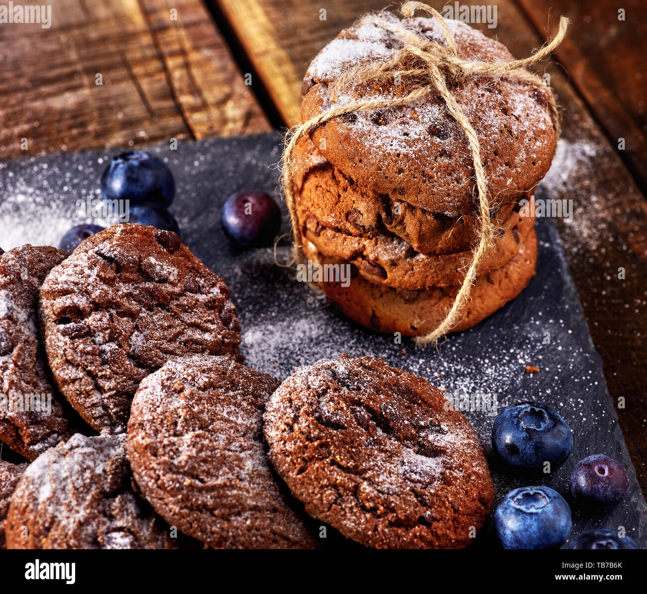 Chocolate chip cookies tied with string. Serving food on slate Stock ...