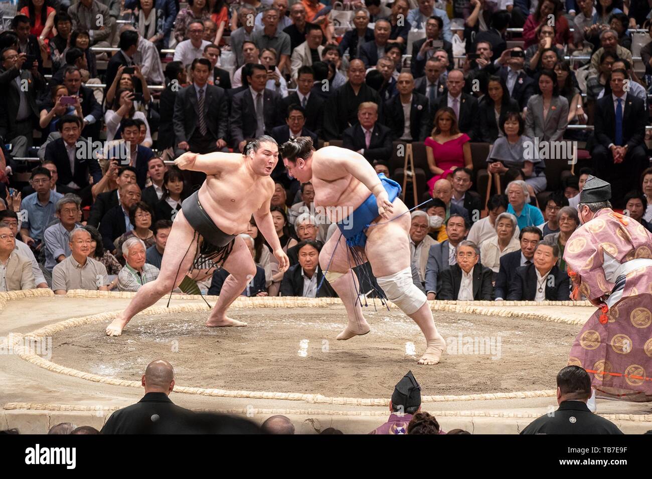 U.S. President Donald Trump and First Lady Melania Trump, center, watch ...