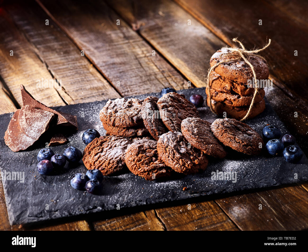 Chocolate chip cookies tied with string. Serving food on slate Stock ...
