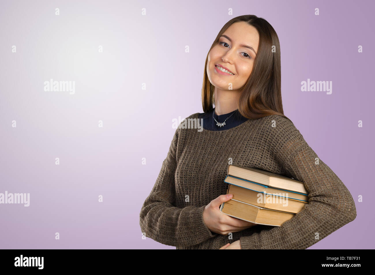 Business woman carrying heavy books Stock Photo - Alamy