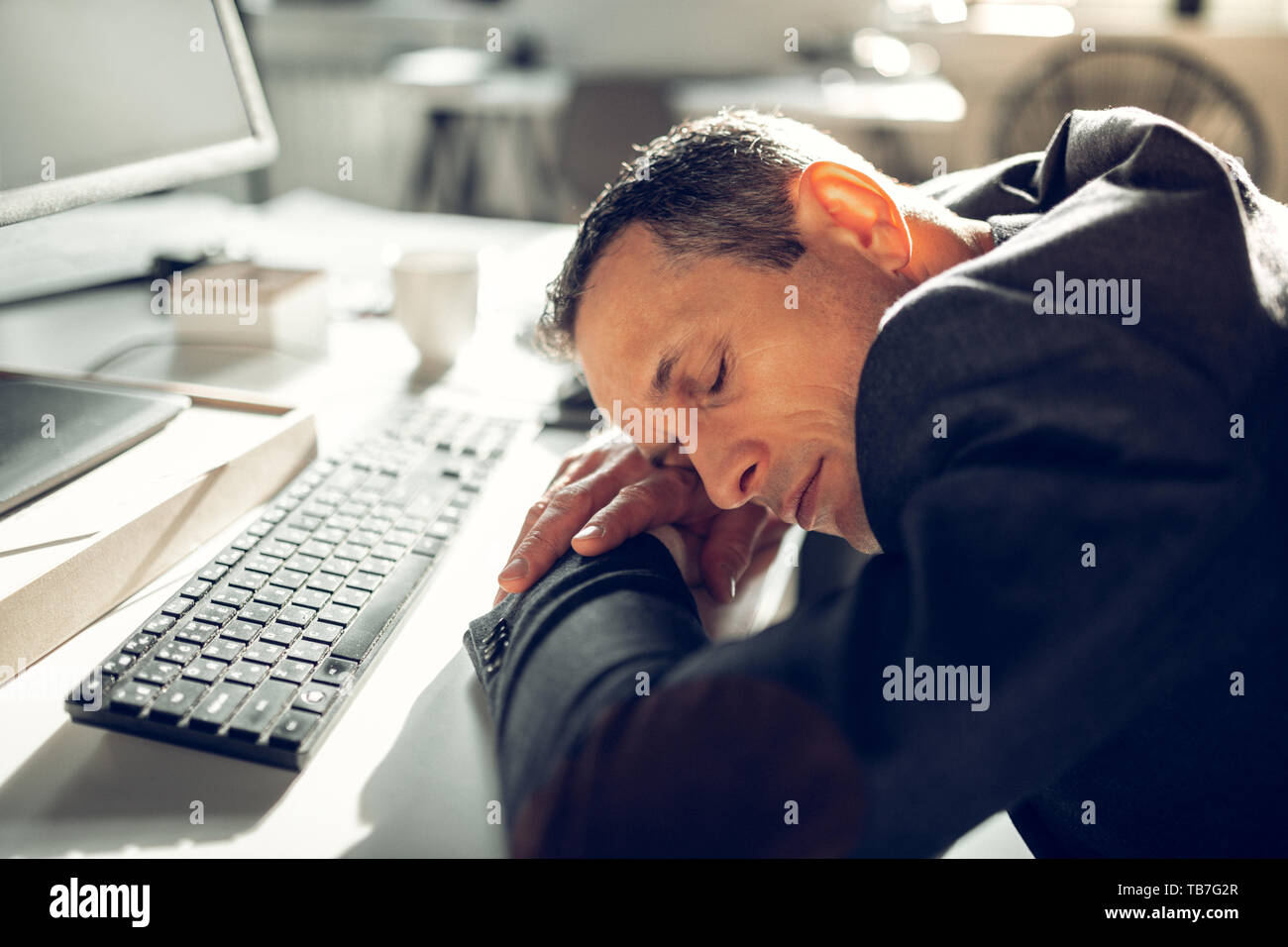 Middle aged businessman falling asleep hi-res stock photography and ...