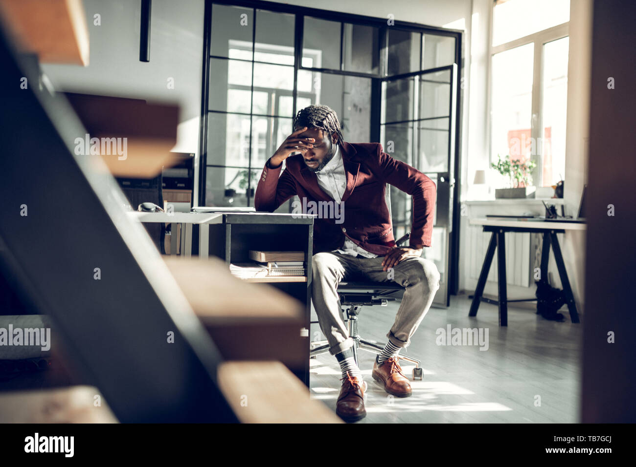 Businessman feeling overloaded with too much work Stock Photo - Alamy
