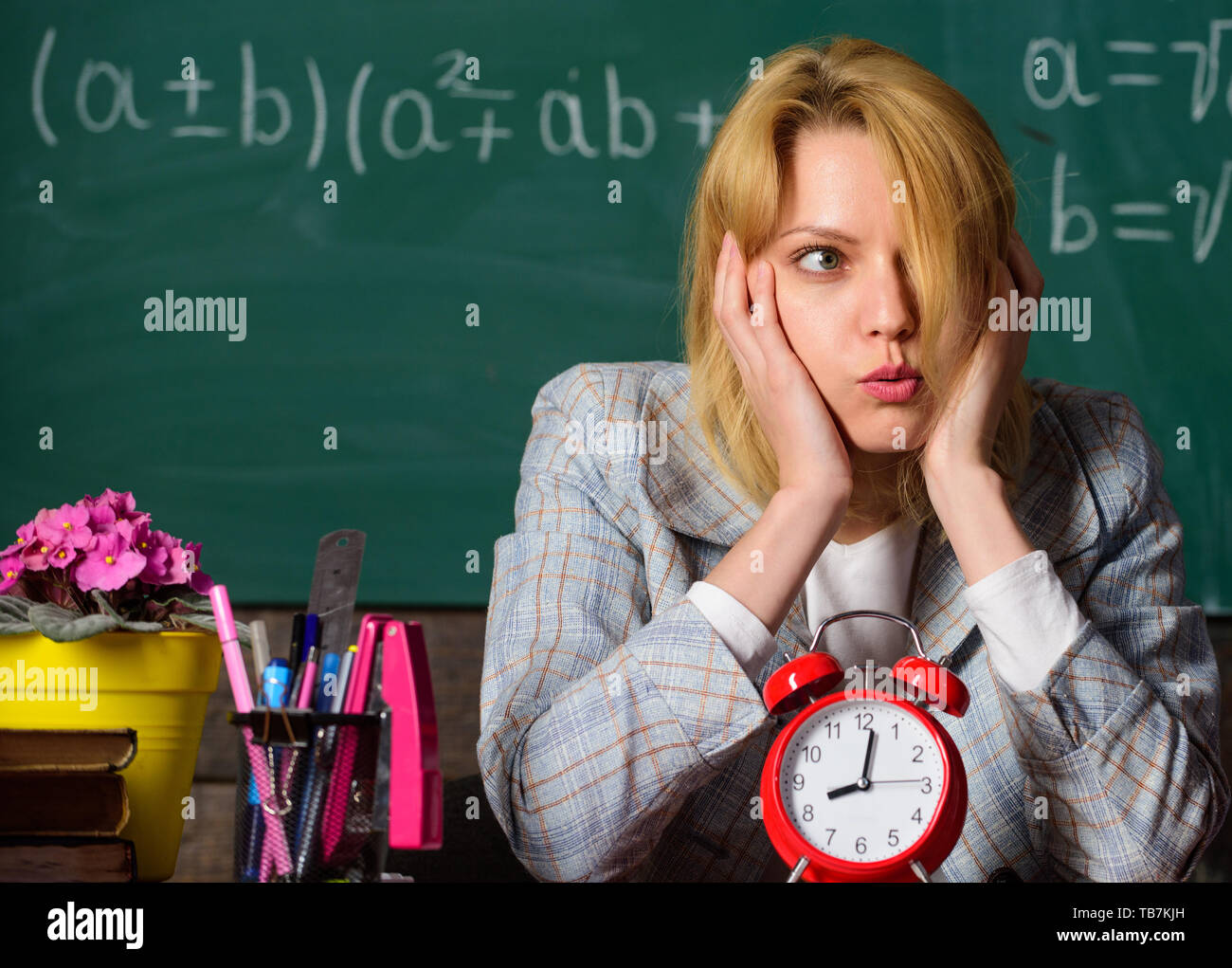 time is gone. teacher with alarm clock at blackboard. Time. Back to ...