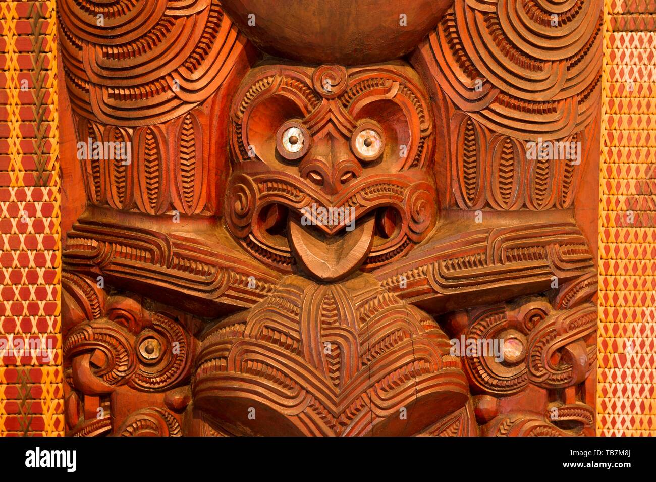 Figure, face, traditional Maori carving in the assembly hall Te Whare ...