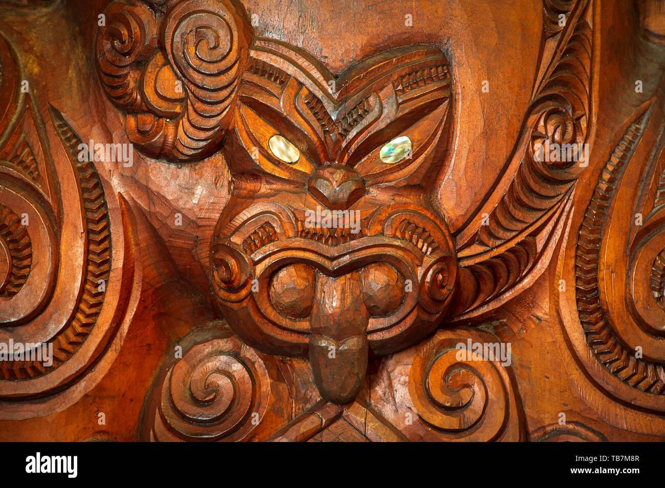 Figure, face, traditional Maori carving in the assembly hall Te Whare ...