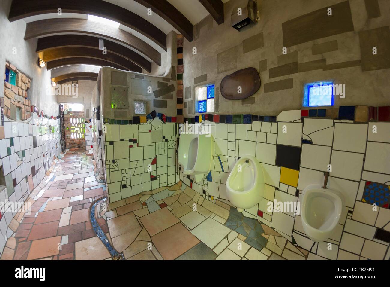 Urinal with ceramic tiles in the public toilet of the artist and ...
