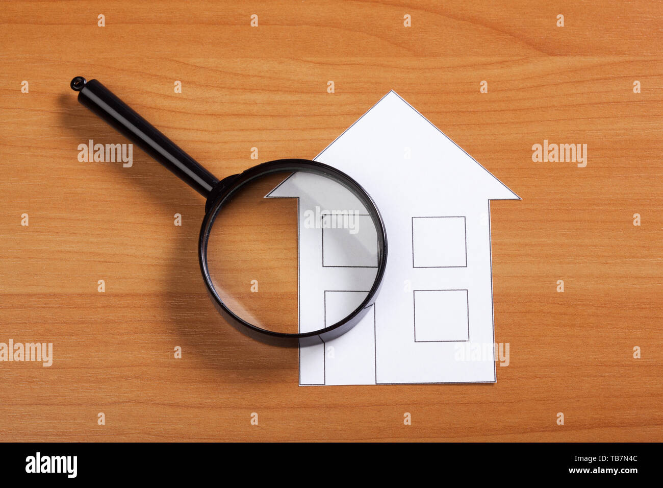 paper house with Magnifying Glass Stock Photo - Alamy