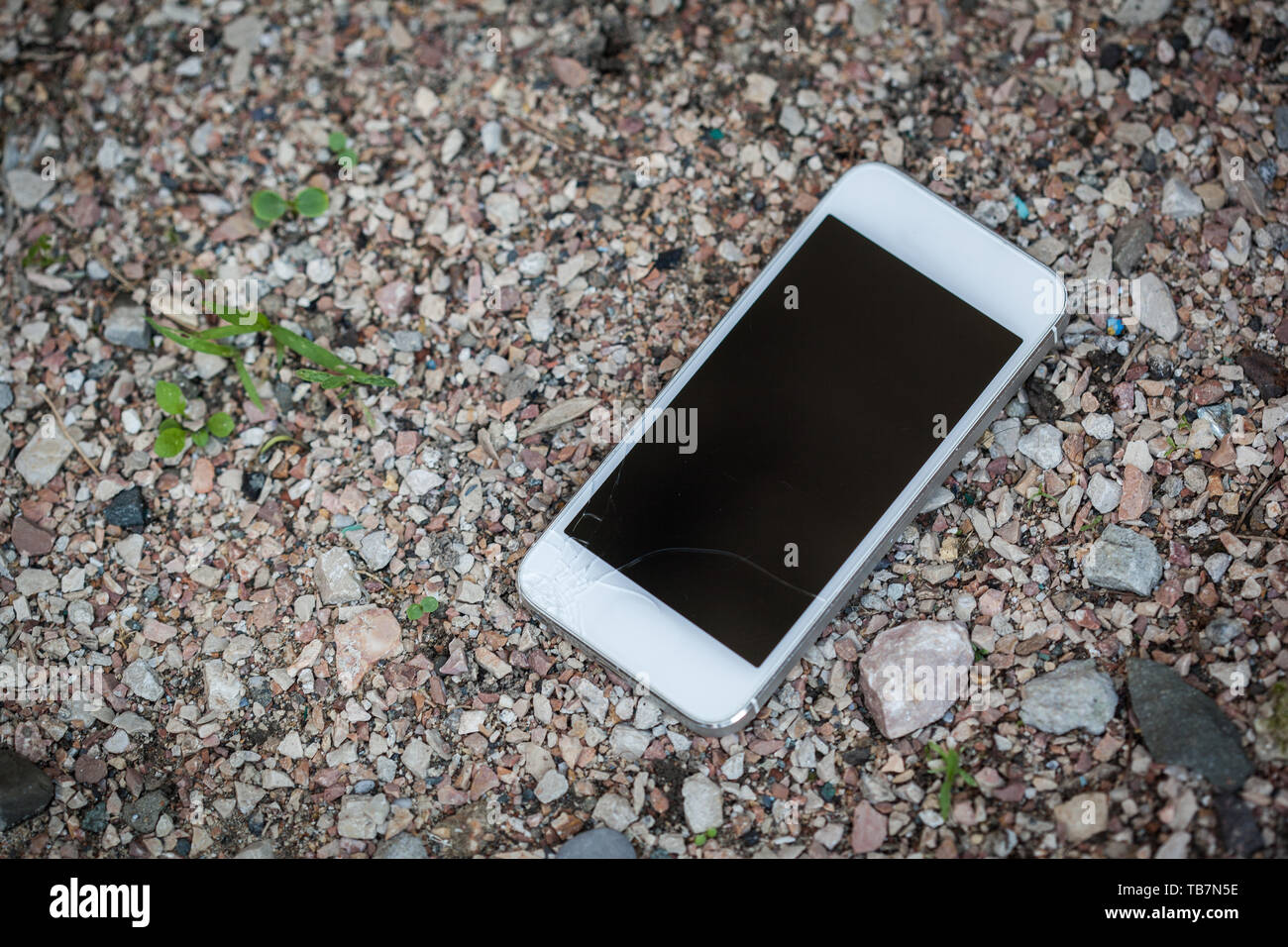 Smartphone drop to the floor and screen damage Stock Photo - Alamy