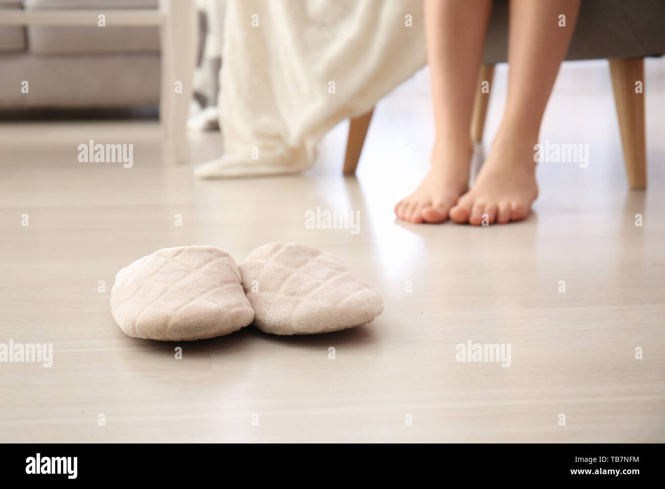 Female slippers on floor in room Stock Photo - Alamy