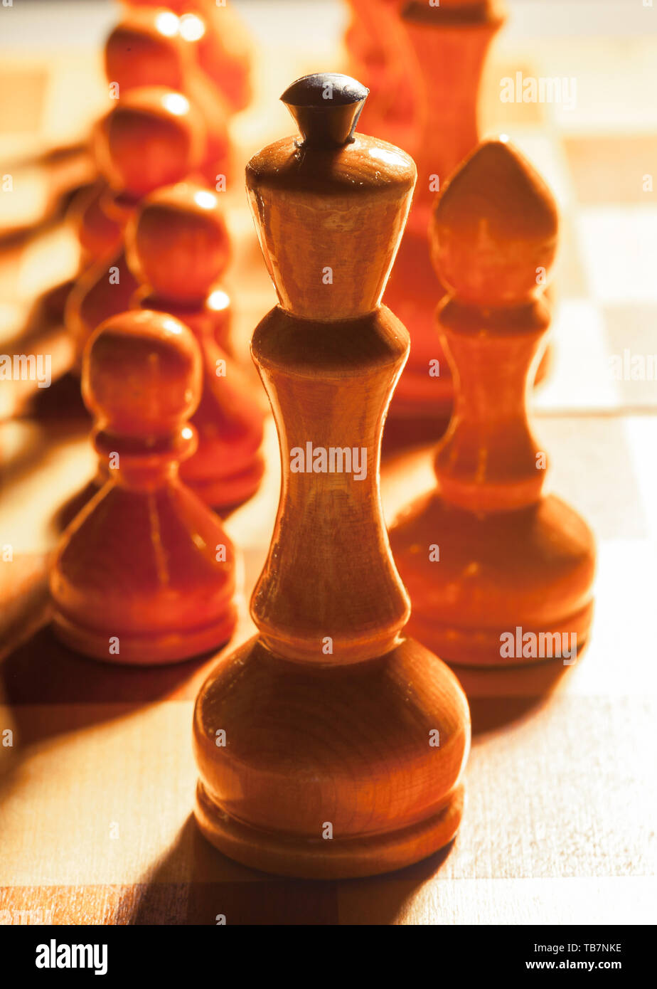 Small wooden chess pieces Stock Photo - Alamy