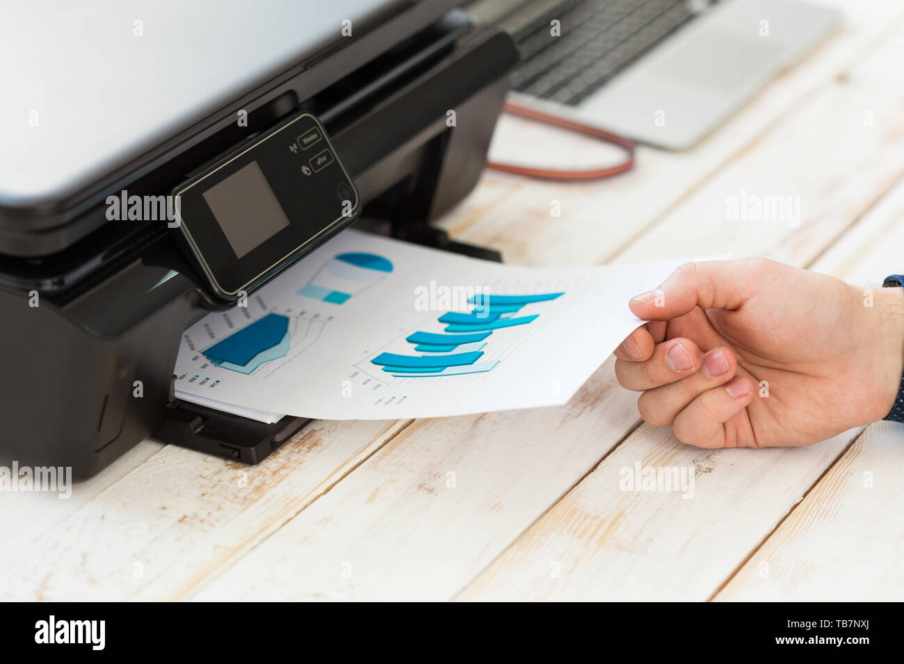 Man's hand making copies. Working with printer Stock Photo - Alamy