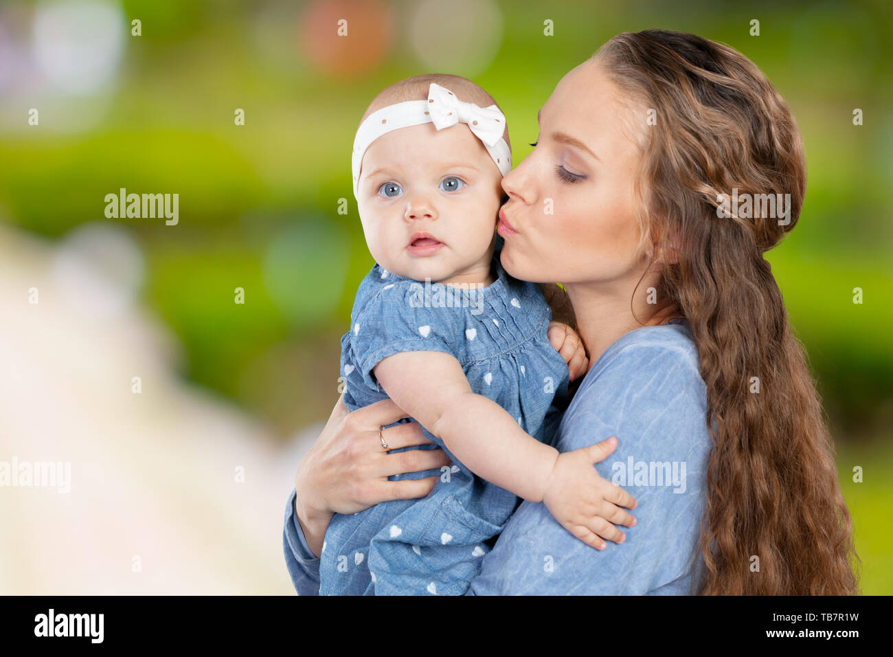 mother hugs a young child Stock Photo - Alamy
