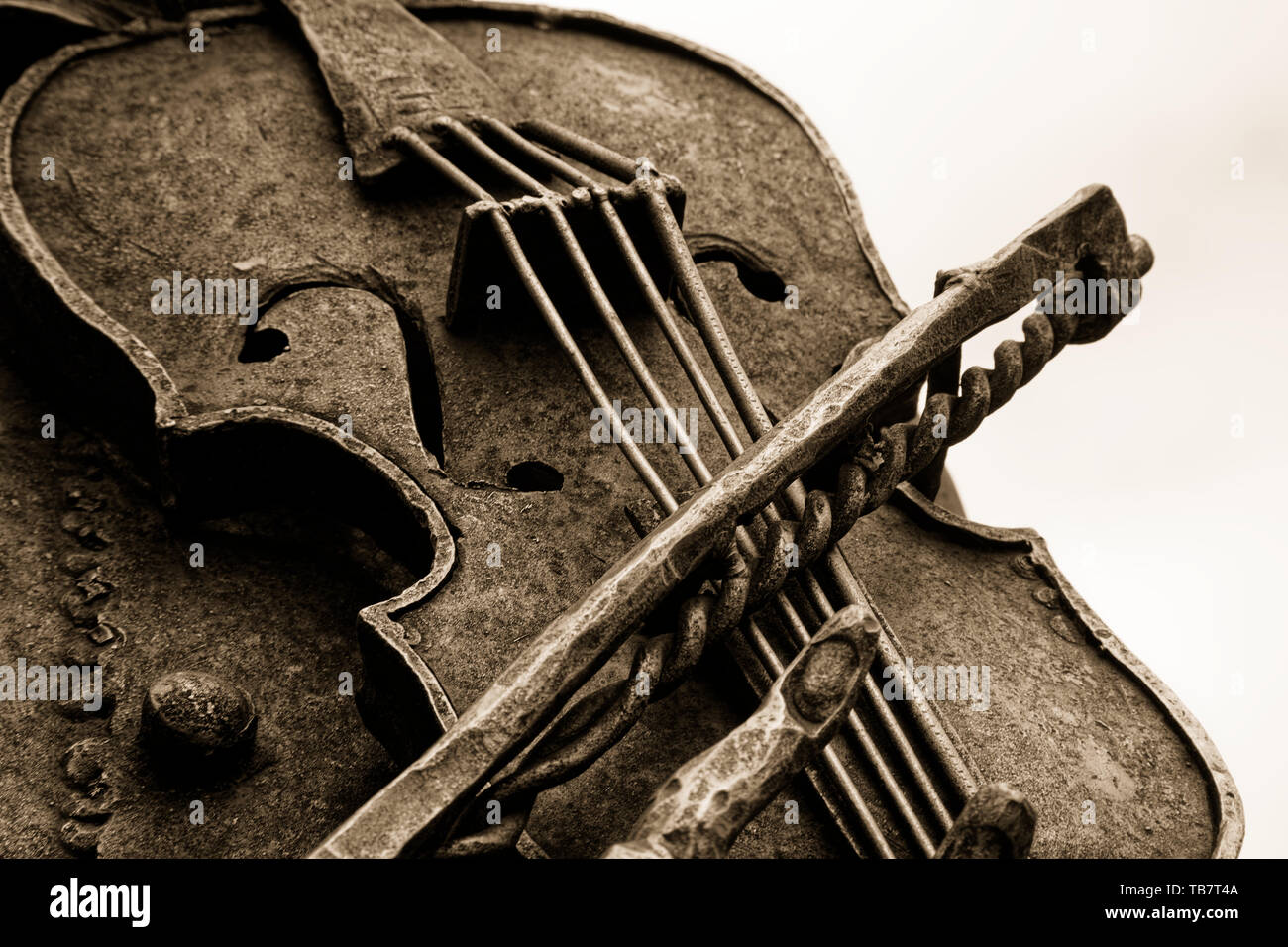 Old rusty statue with iron violin in public park Stock Photo - Alamy