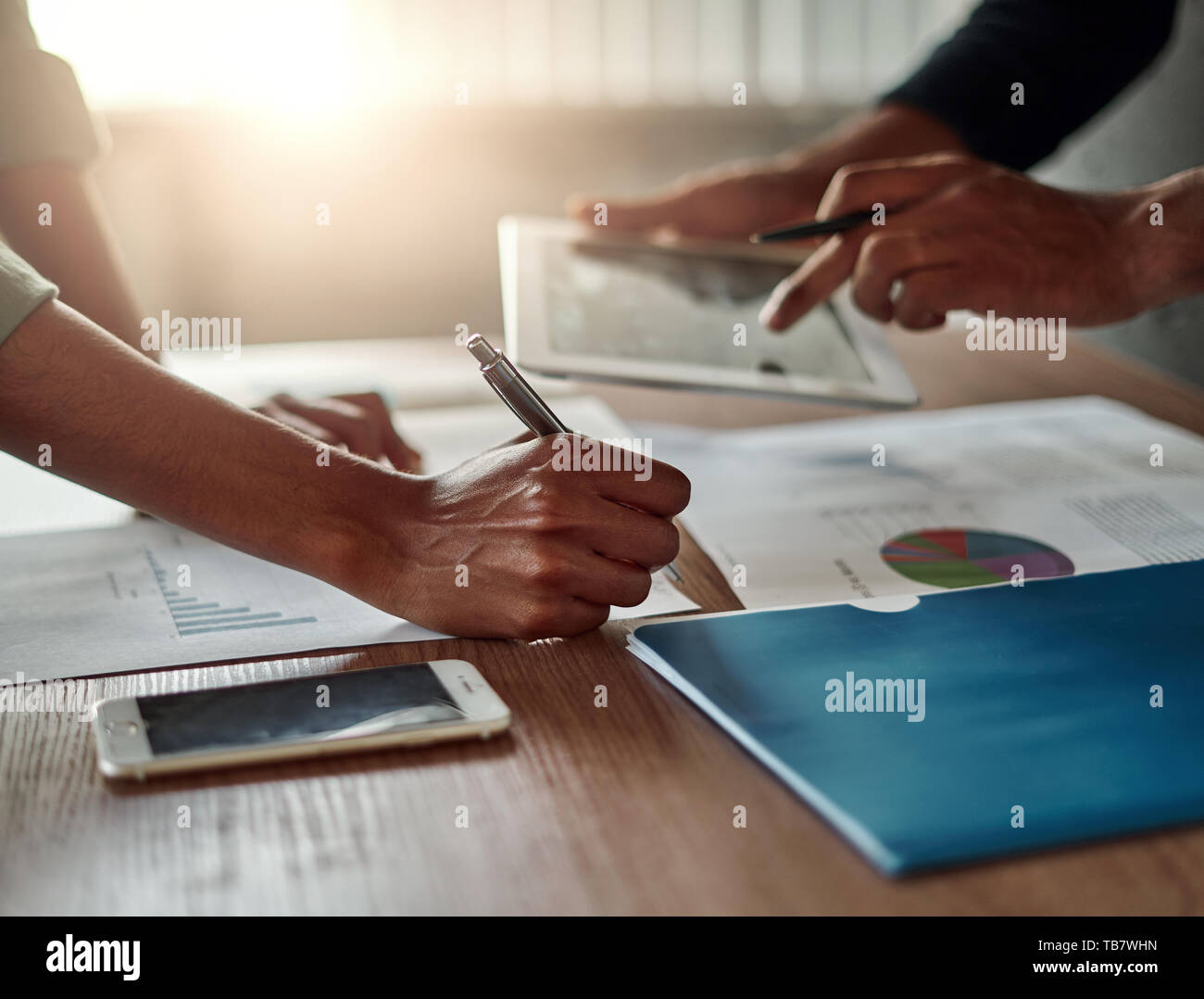 Business people's hand analyzing the graph in the office Stock Photo ...