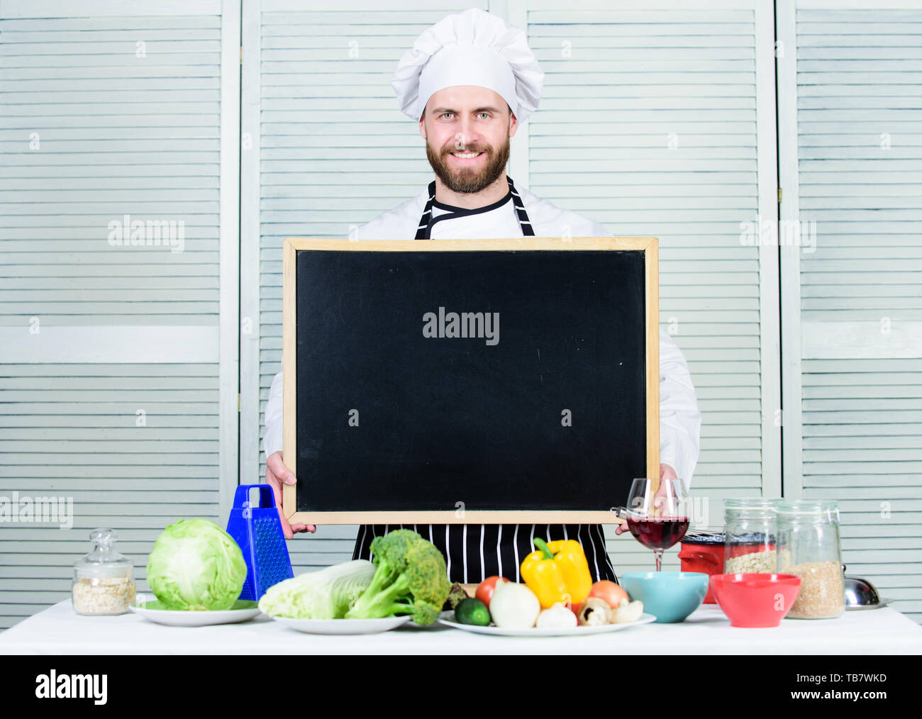 Culinary school. Chief cook teaching master class in cooking school ...