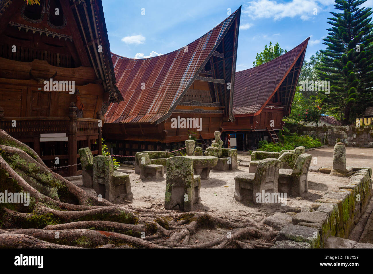 Stone chairs of Ambarita and traditional Batak roof houses, Samosir ...