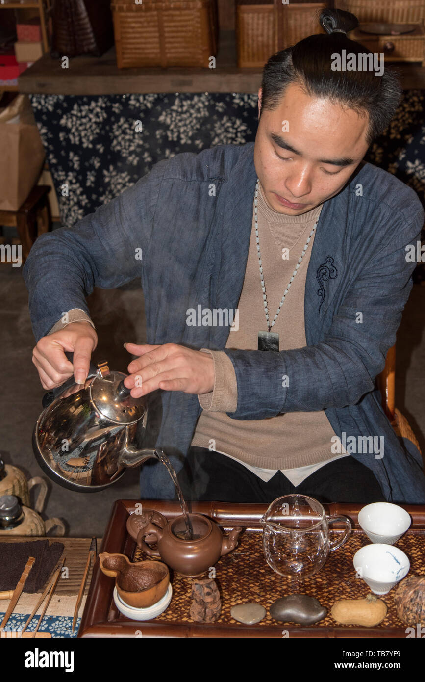 Chinese Tea Ceremony. Male server prepares the traditional tea ...