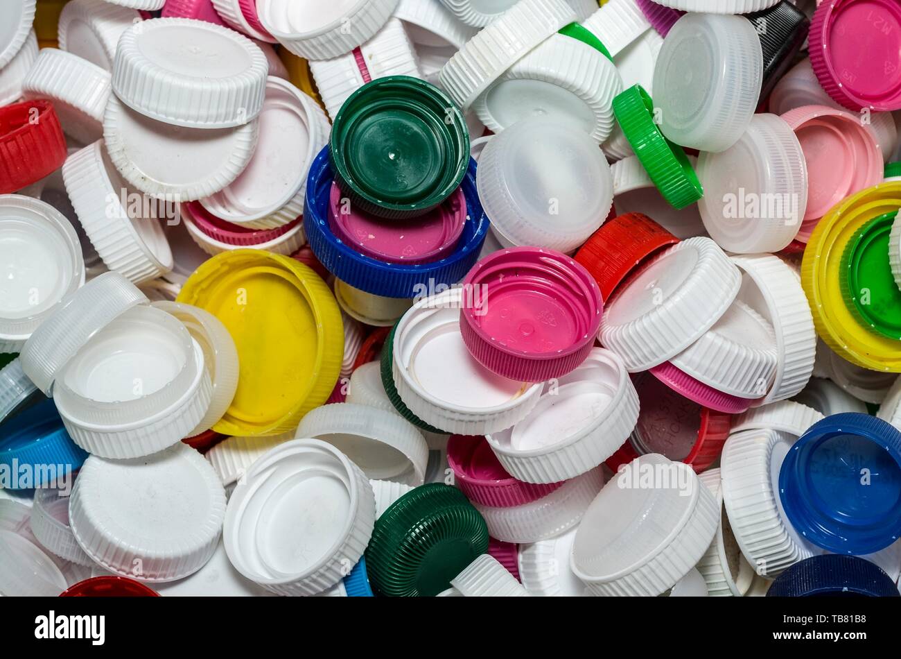 Collection of plastic caps for recycling Stock Photo - Alamy