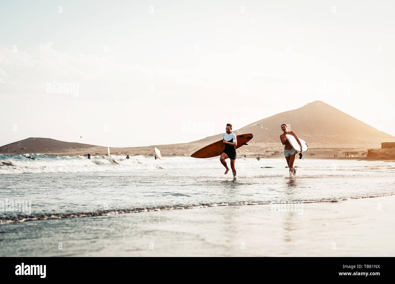 Couple And Surfboards And Holiday High Resolution Stock Photography and ...