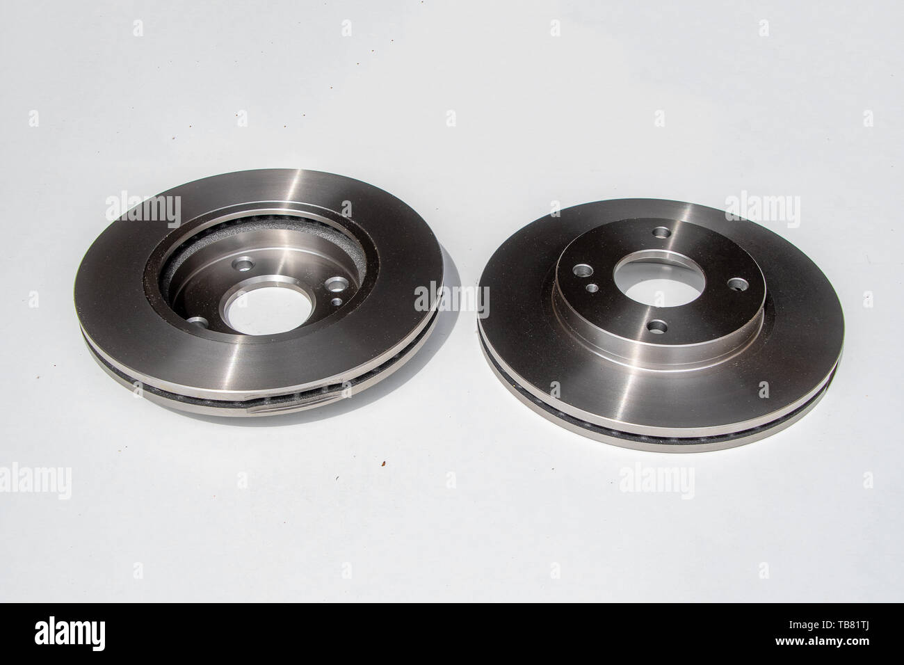 Front and back view of new car brake discs Stock Photo - Alamy
