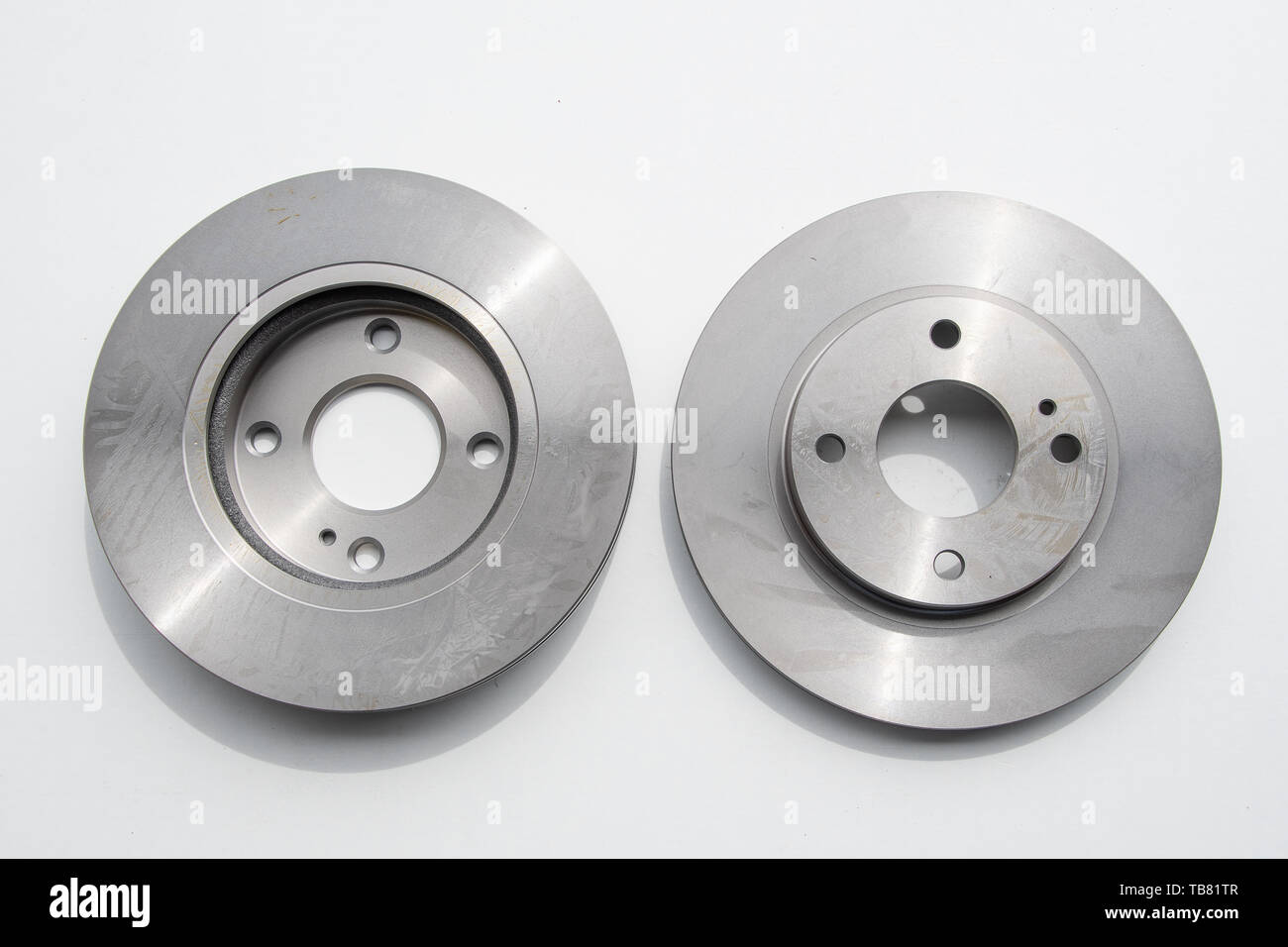 Front and back view of new car brake discs Stock Photo - Alamy