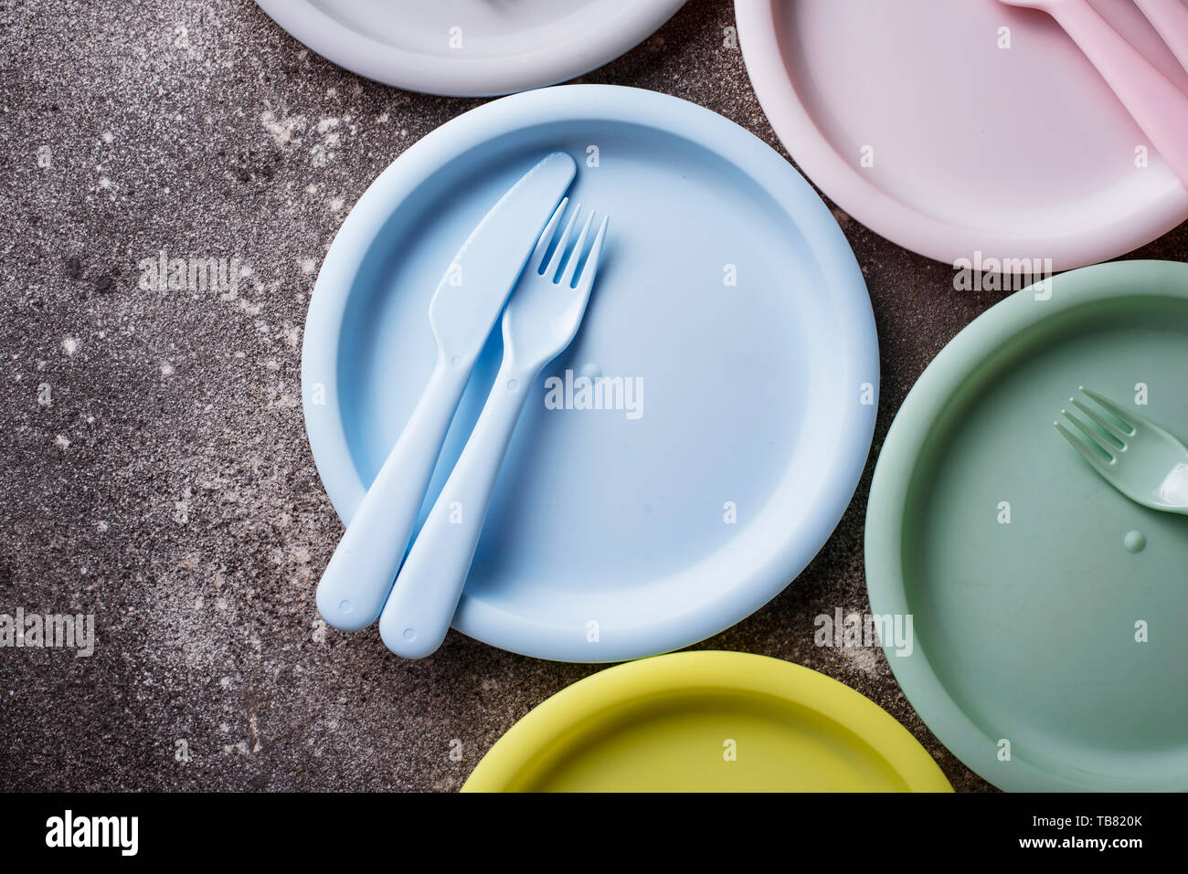 Colorful plastic dishes for summer picnic Stock Photo - Alamy