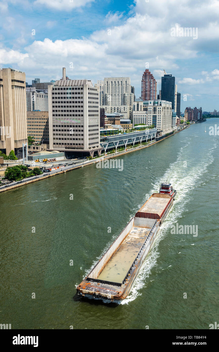 Overview of a empty heavy large cargo ship sailing on the East River in ...