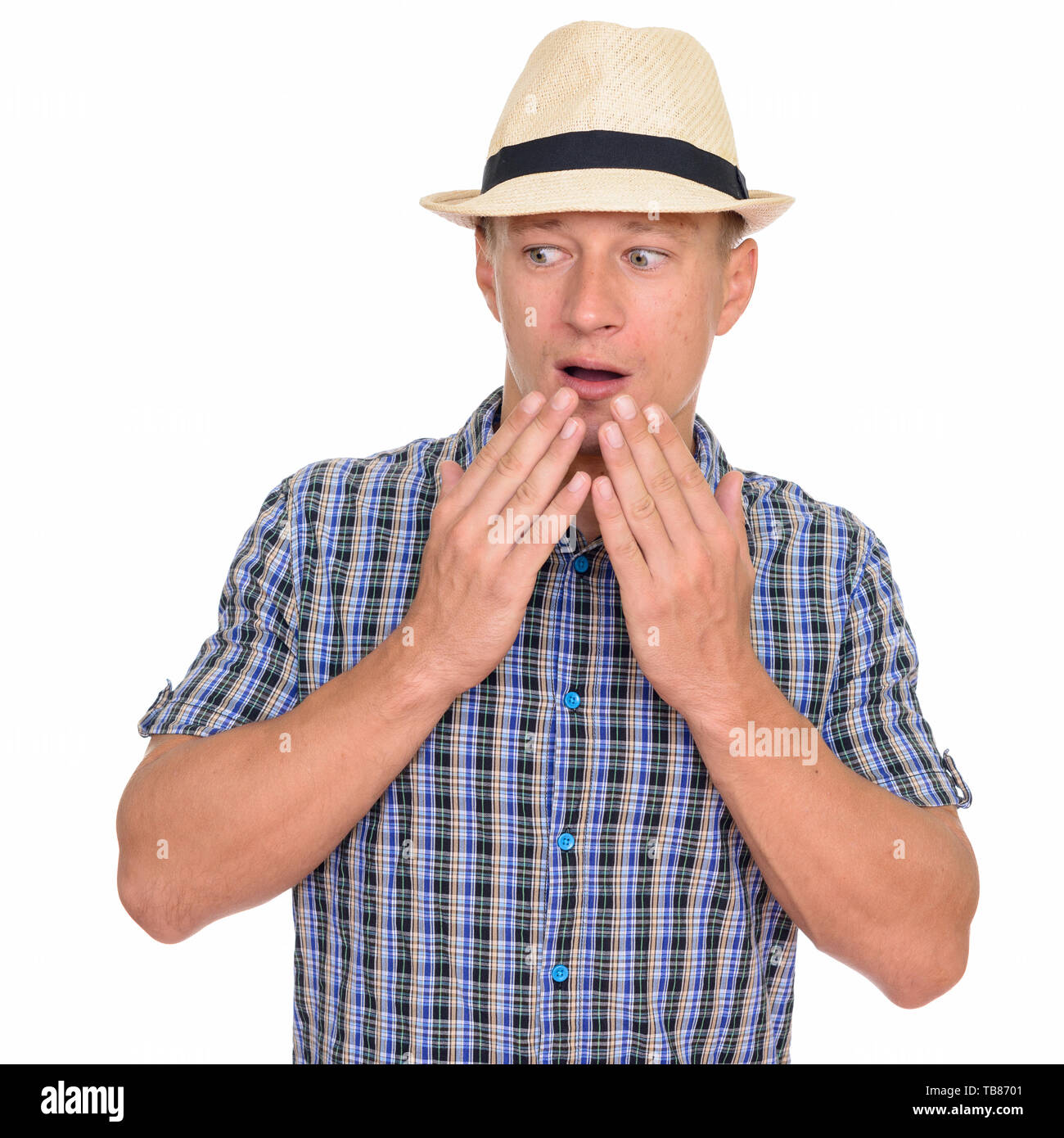Studio shot of young handsome Caucasian man looking shocked isolated ...