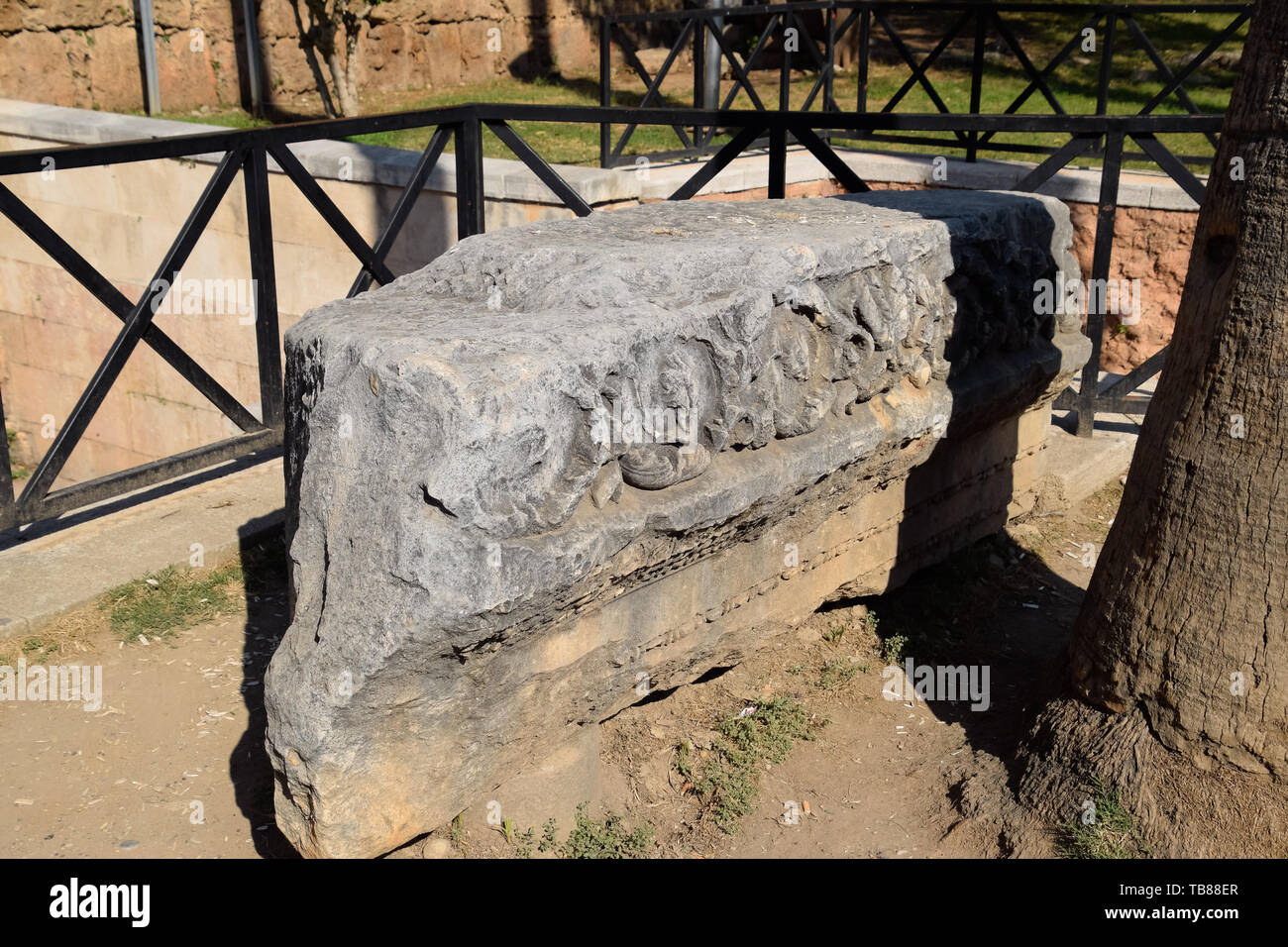 The element of the gate of Hadrian on the ground near the gate. Ruins ...