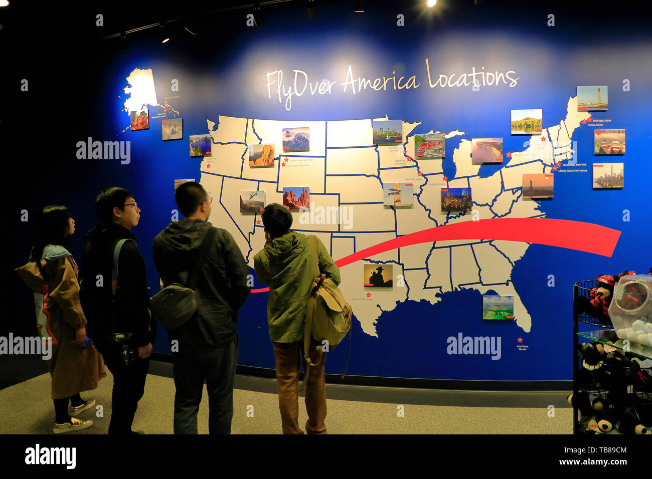 Visitors check out the fly route on the USA map of Fly Over America ...