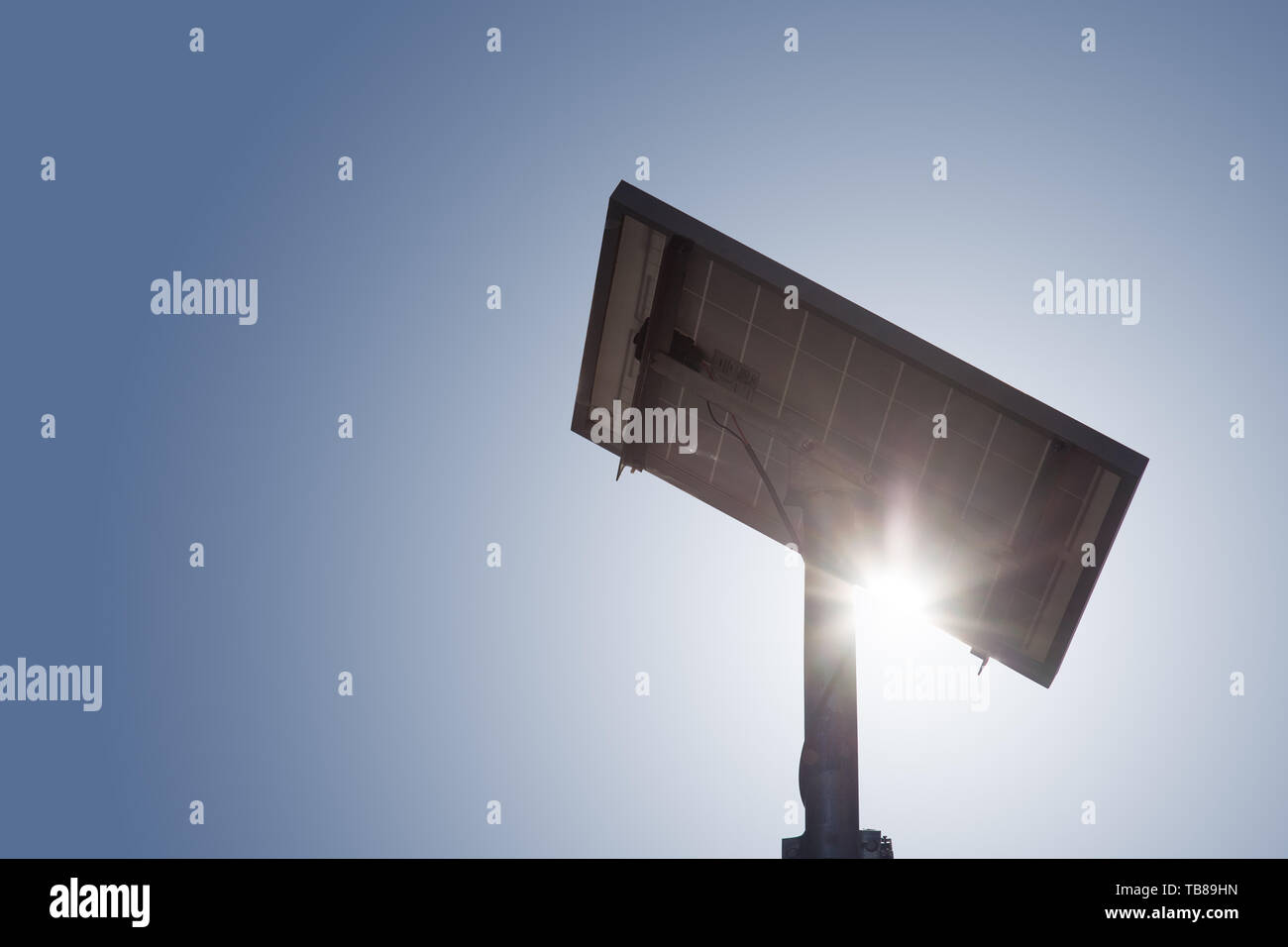 Solar panels. Back side of solar panel and sunny blue sky Stock Photo ...