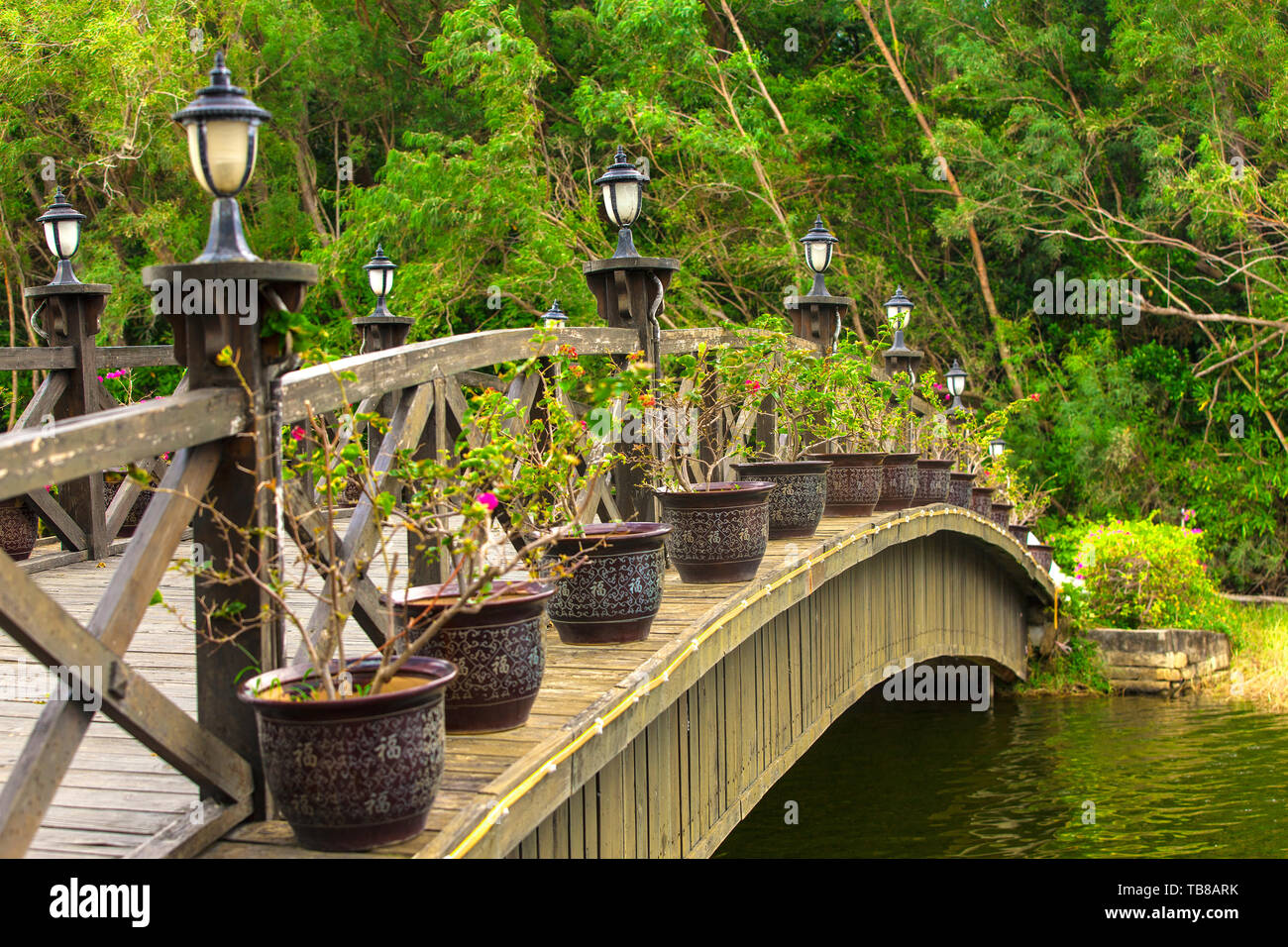 Beautiful wooden bridge across river Stock Photo - Alamy