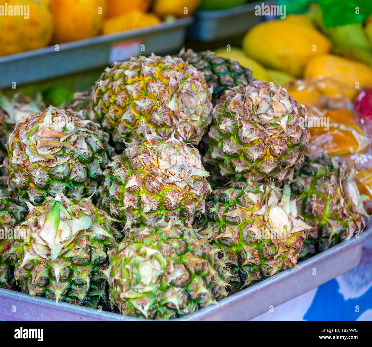 fruit background with many fresh ripe pineapples for sale on local ...