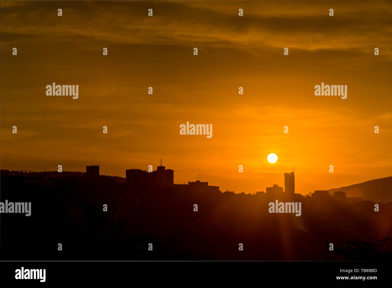 The silhouette of Kigali city centre skyline at sunset. Rwanda Stock ...