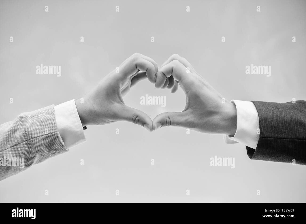 Hand heart gesture forms shape using fingers. Male hands in heart shape ...