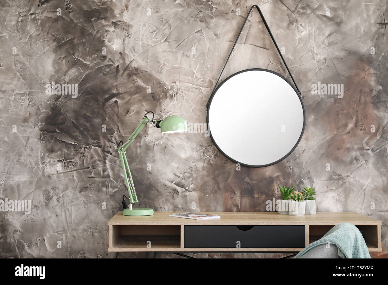 Interior of modern room with table and mirror Stock Photo - Alamy